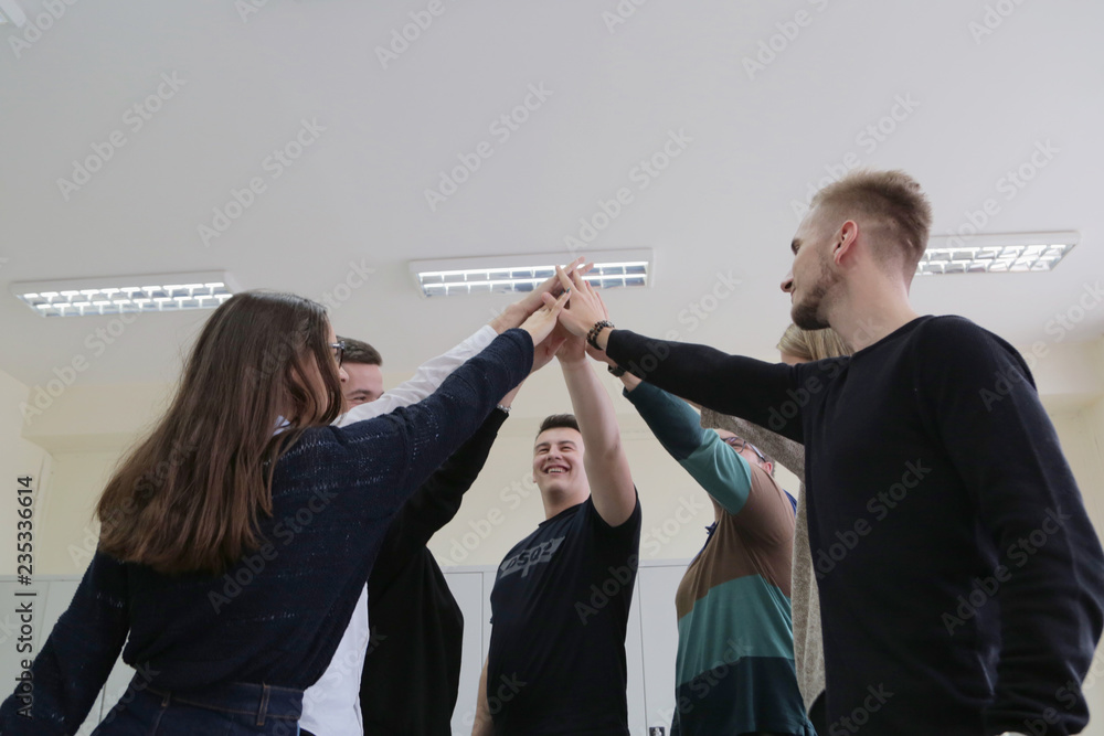Group of young students in technical vocational training celebrating ...