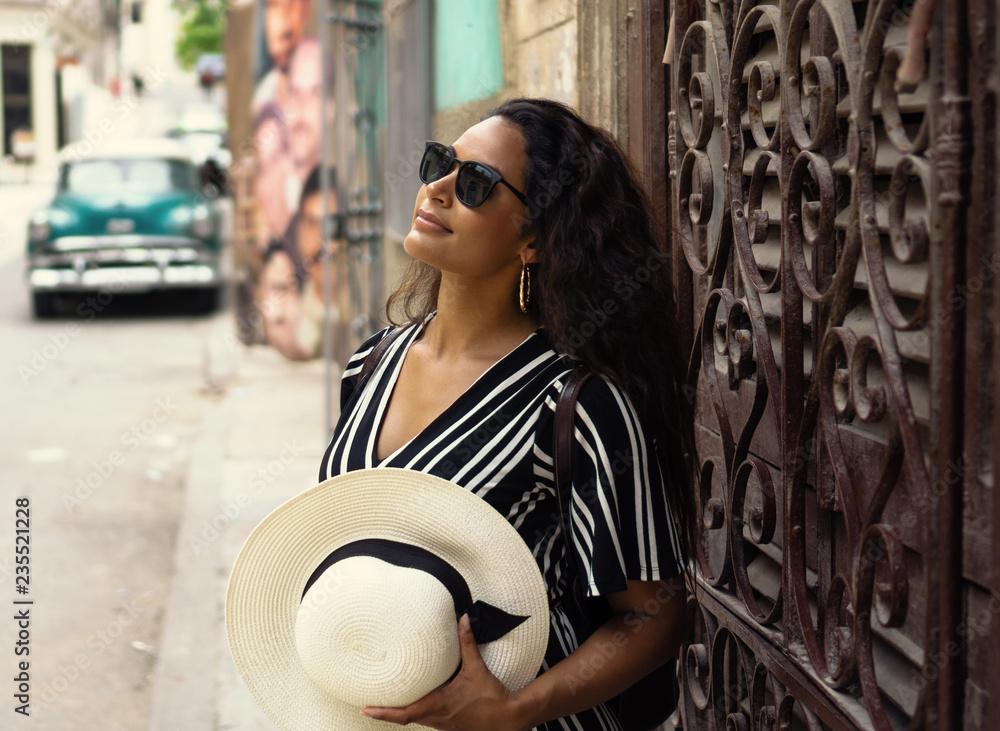 Young beautiful black woman with a typical cuban hat standing in the ...