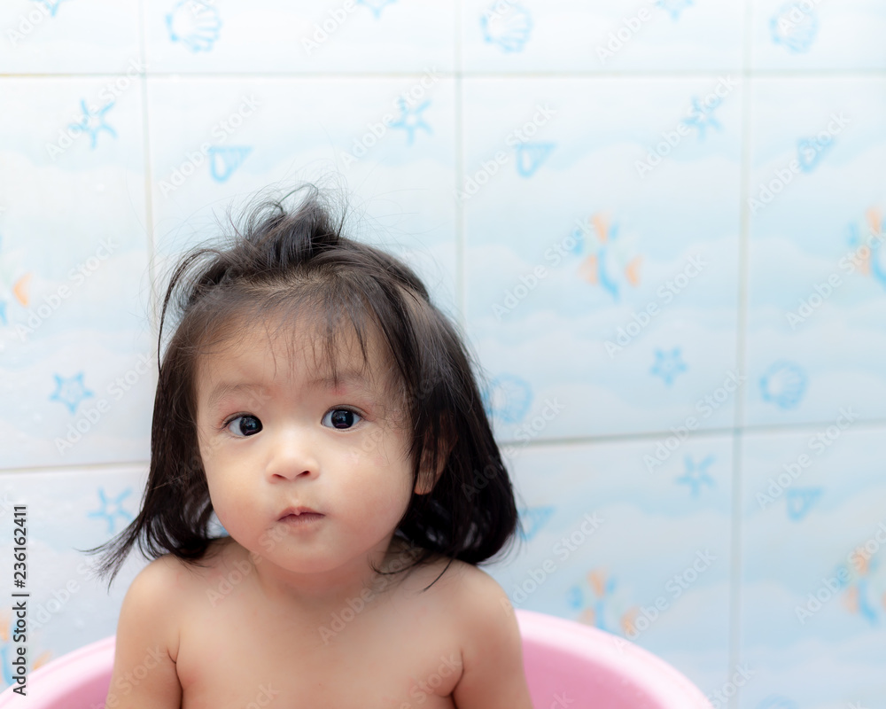 ภาพถ่าย Stock Asian girl bathing in bathtub in bathroom | Adobe Stock