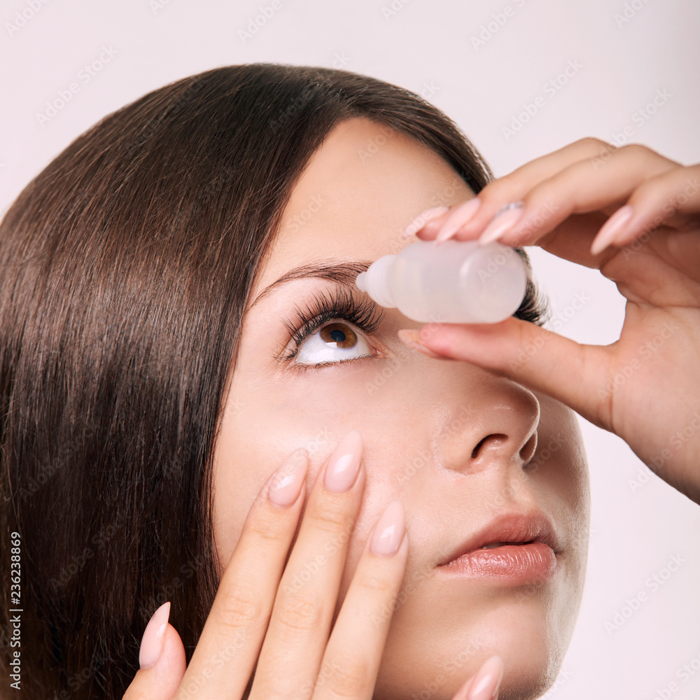 Young girl using eye drops. Glaucoma recovery Stock Photo | Adobe Stock