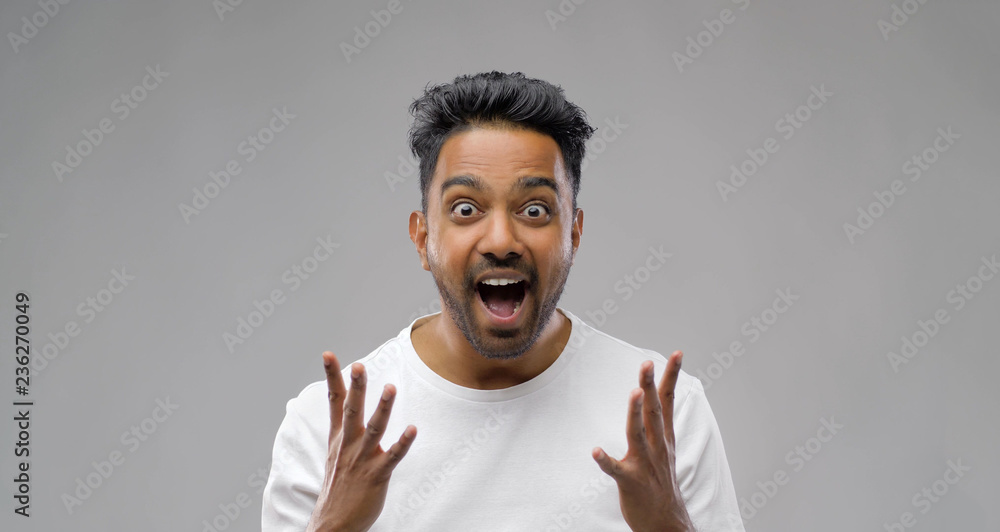 success, emotion and expression concept - happy young indian man ...