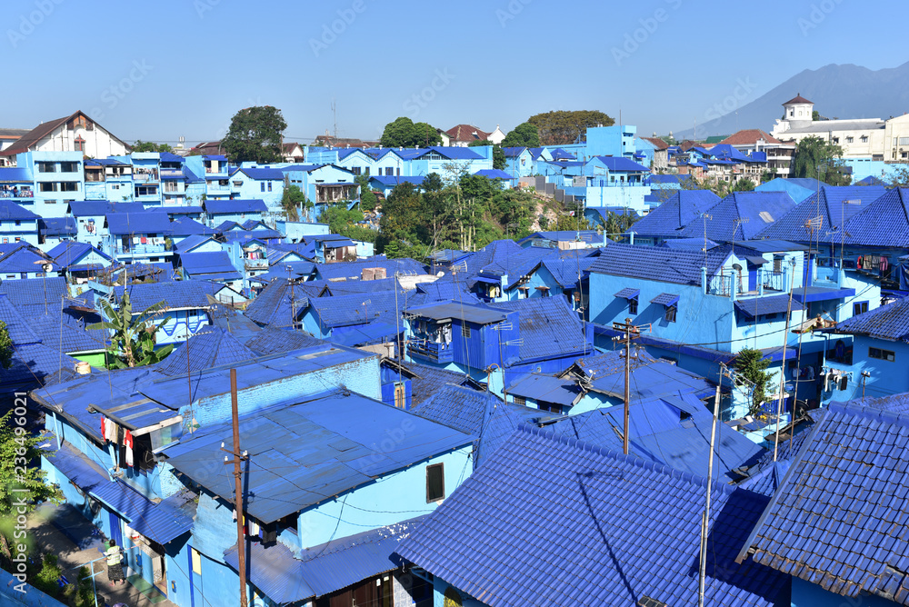 Panoramic view of village with old houses and rooftops painted in blue ...