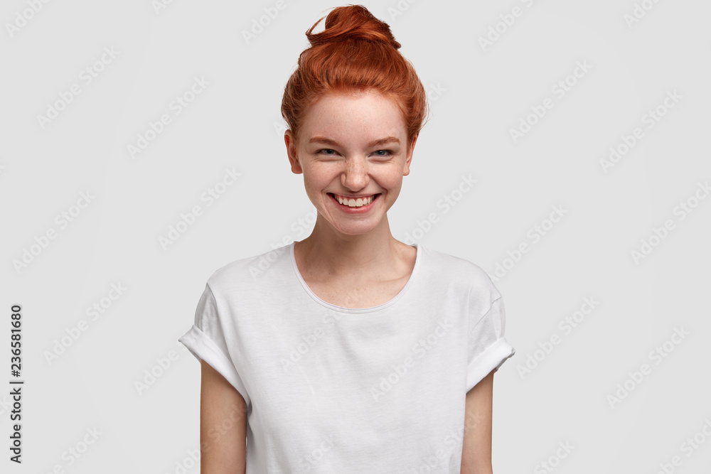 Photo Stock Photo of glad lovely red haired teenage girl smiles with ...