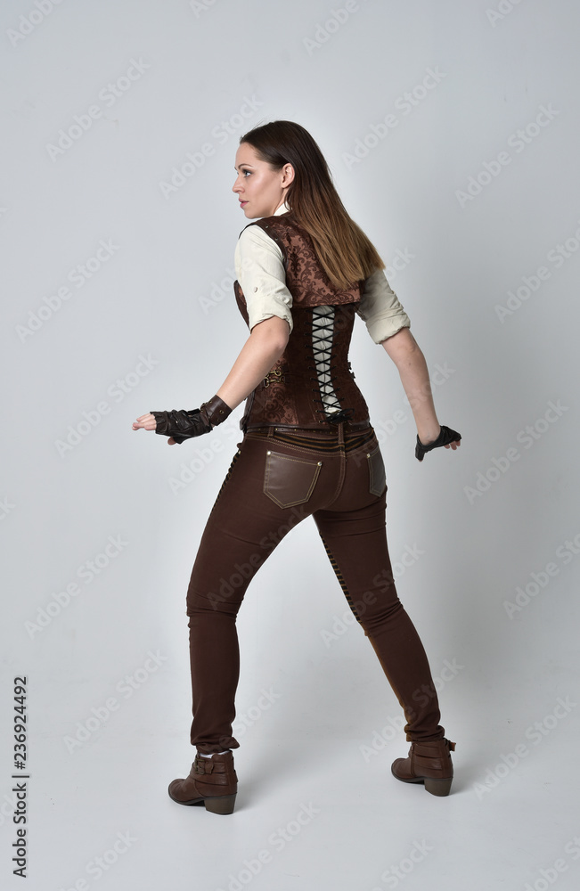 full length portrait of brunette girl wearing brown leather steampunk ...