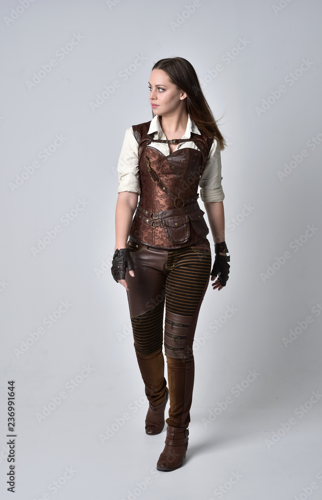 full length portrait of brunette girl wearing brown leather steampunk ...