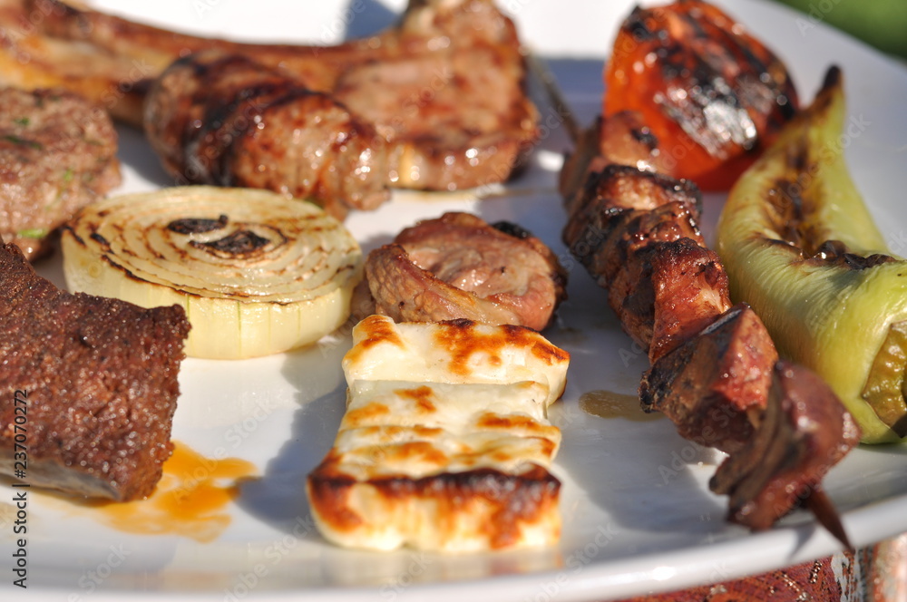 Traditional Cypriot meze and kebap barbecue party in the garden with ...