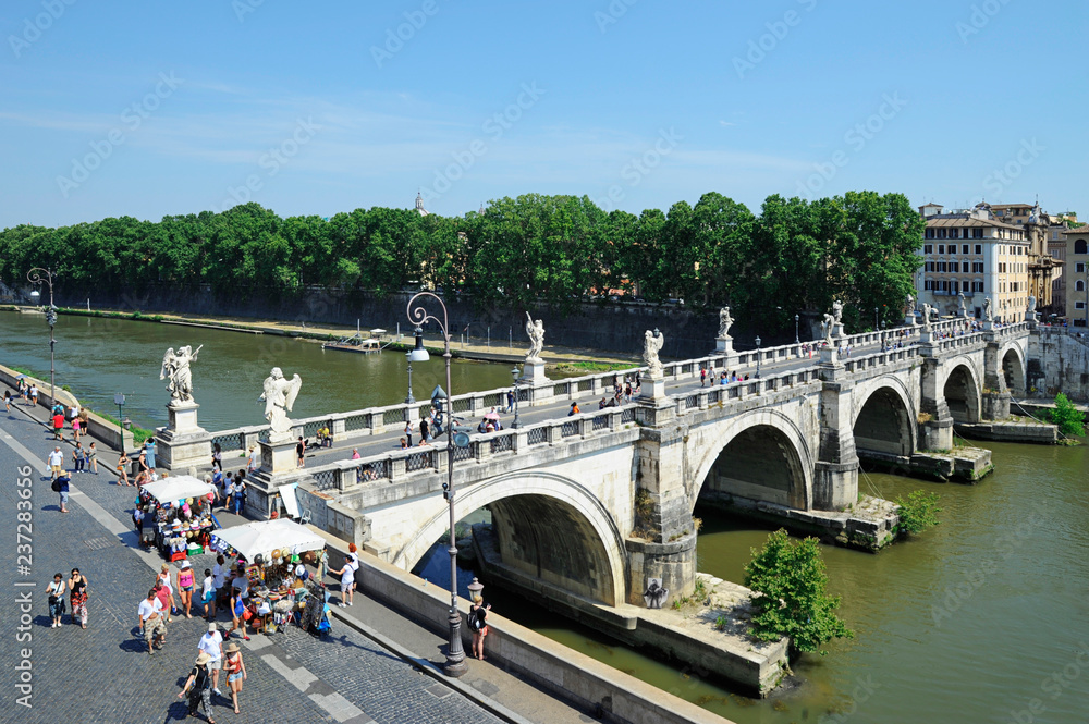 Ponte Sant Angelo also known as Bridge of Angels, over Tiber near Saint Angelo Castle, featuring ...