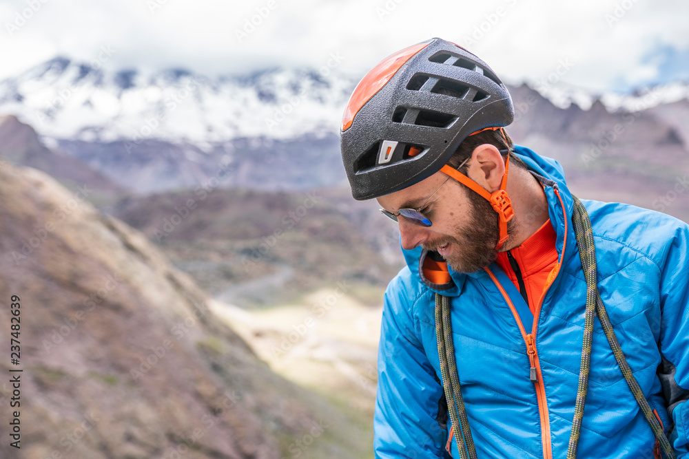 Face expressions while a climber climb a big wall inside the Andes, an ...
