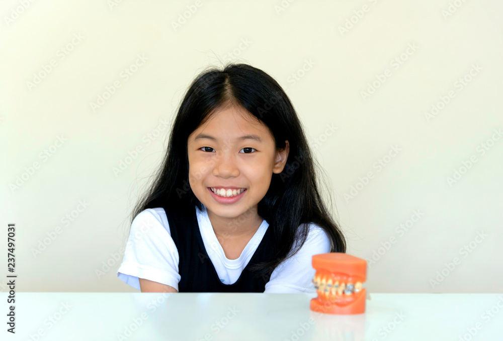 Stock-Foto „Asian pre teen girl with clean overbite tooth smiling in ...