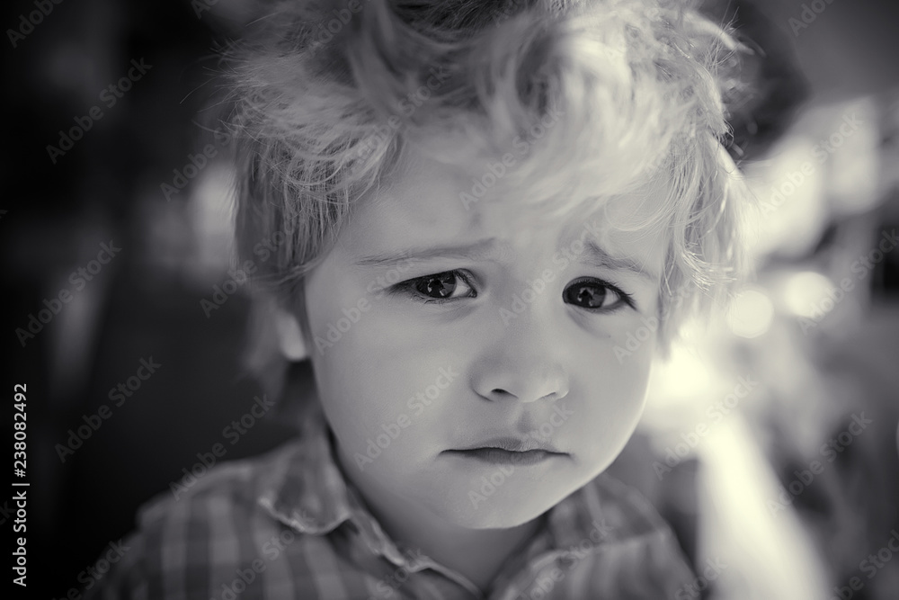 Upset. Sad kid, melancholic mood. Black and white portrait of unhappy ...