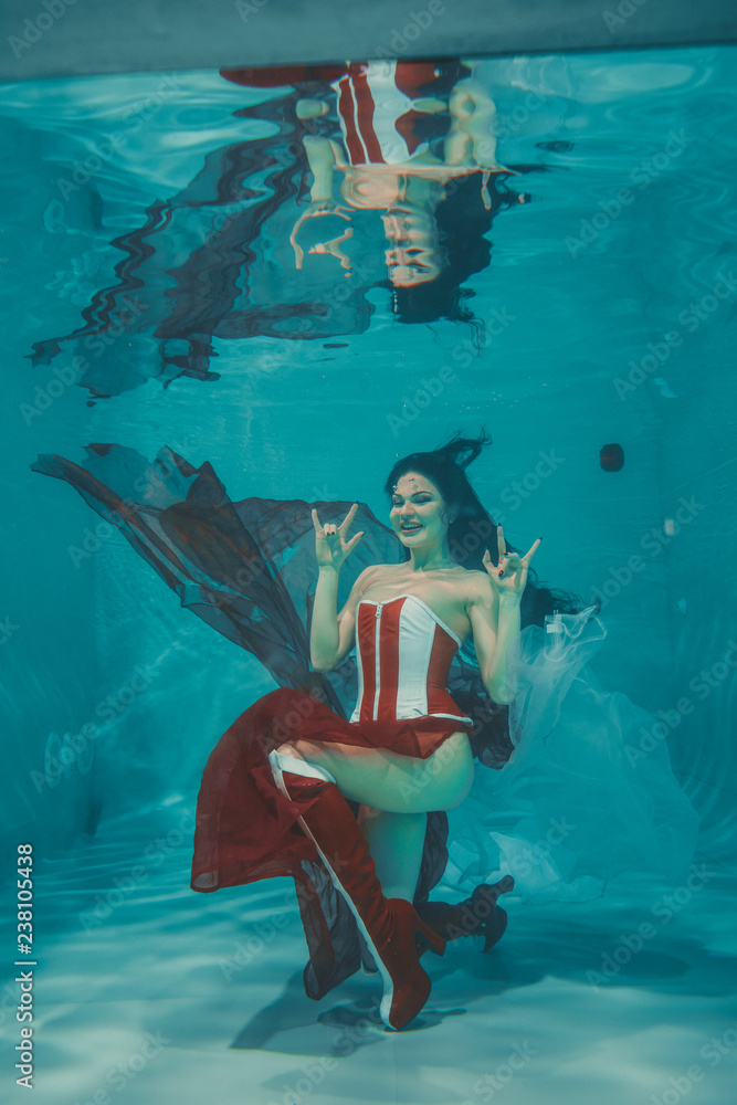 Beautiful Sexy Girl Swimming Underwater In Sporty Style Red And White