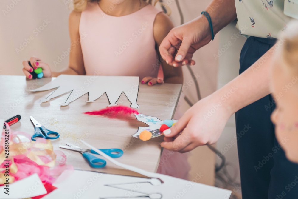 Pompons, paper crown, spangles. Project of children's creativity ...