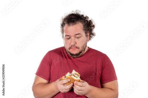 Sad fat man eating burger. Fast food, unhealty eat. Overweight and ...