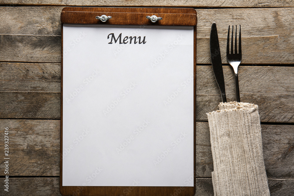 Blank menu with cutlery on wooden table Stock Photo | Adobe Stock