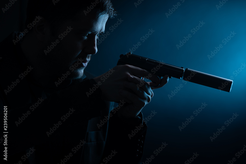 Image of side of thug with pistol Stock Photo | Adobe Stock