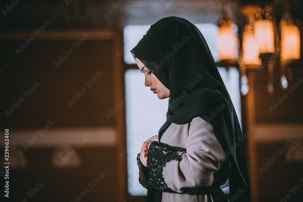 muslim woman praying in mosque Stock Photo | Adobe Stock