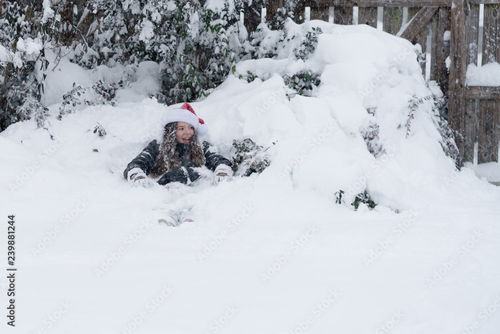 Tween Girl Playing in Snow Stock Photo | Adobe Stock