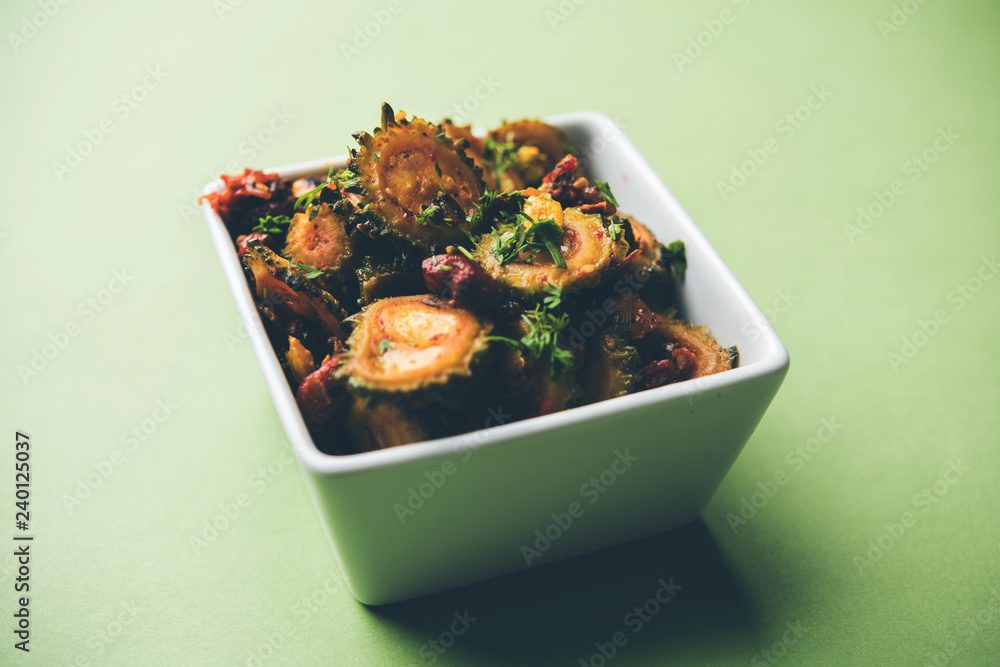 Cooked bitter Melon/gourd or Karela Sabzi served in a bowl. Scientific ...