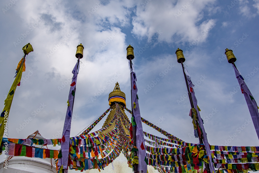 Landscape front view of Boudhanath Stupa and prayer flags. Kathmandu ...