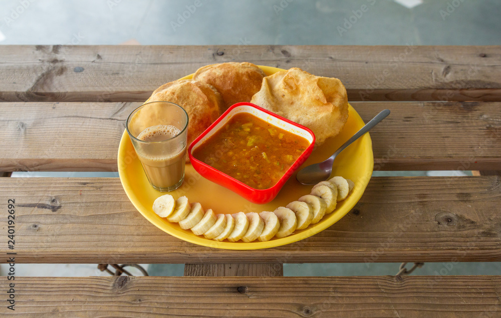 Indian breakfast poori with chai Stock Photo | Adobe Stock