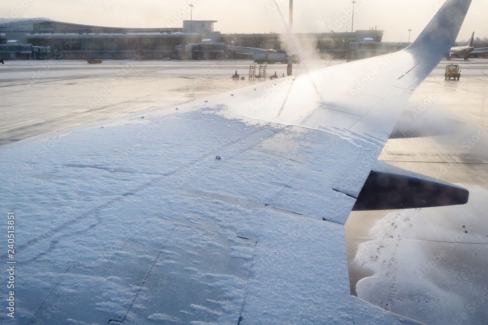 anti-icing processing of aircraft wing in airport Stock Photo | Adobe Stock