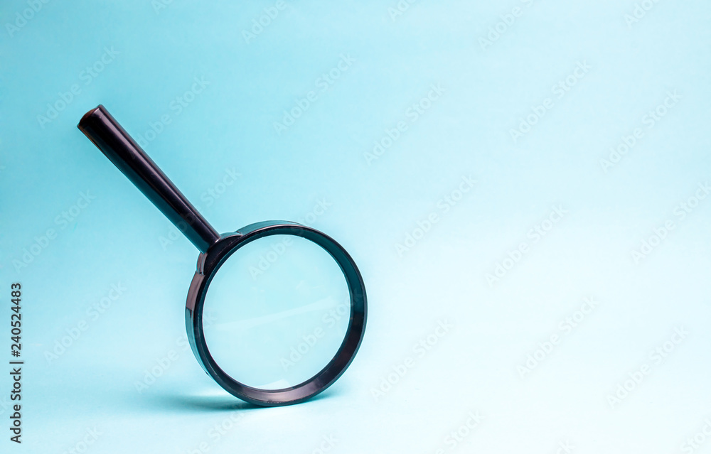 Magnifying glass on blue background. Concept of search and analysis ...