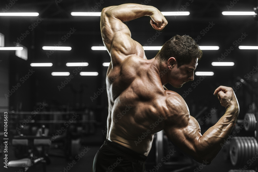 Handsome strong athletic men pumping up muscles workout bodybuilding ...