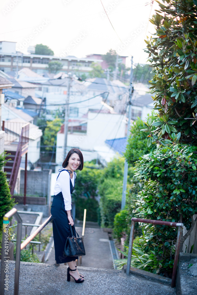 Japanese female model posing for the pictures on the street of Tokyo ...