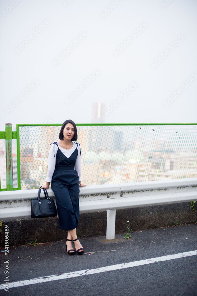 Japanese female model posing for the pictures on the street of Tokyo ...