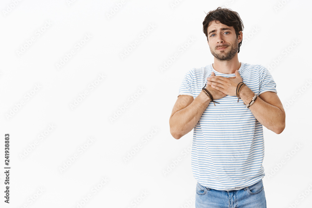 Stock-Foto „Handsome young masculine guy with blue eyes sincerely ...