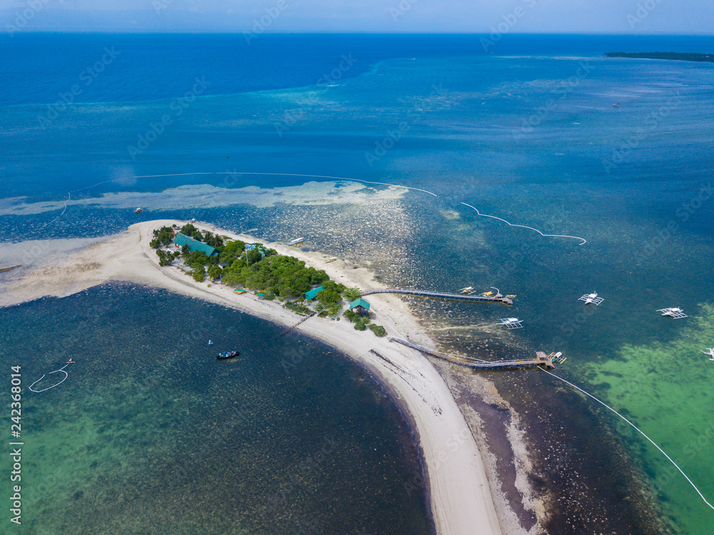 Aerial view of curved beach of Pontod virgin island located near ...
