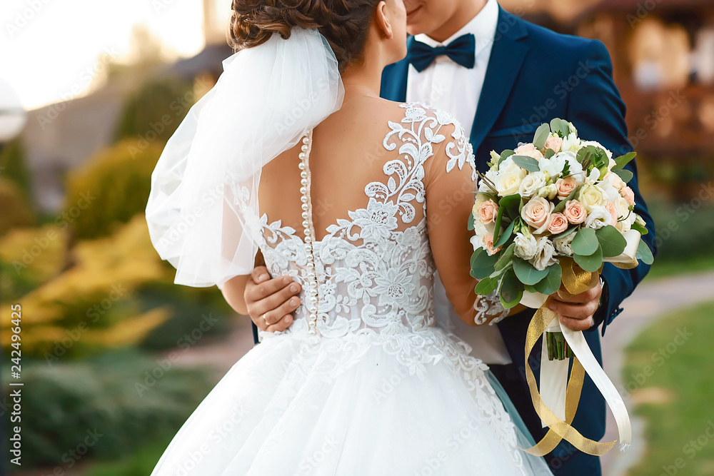Amazing wedding couple. Pretty bride and stylish groom. selective focus ...
