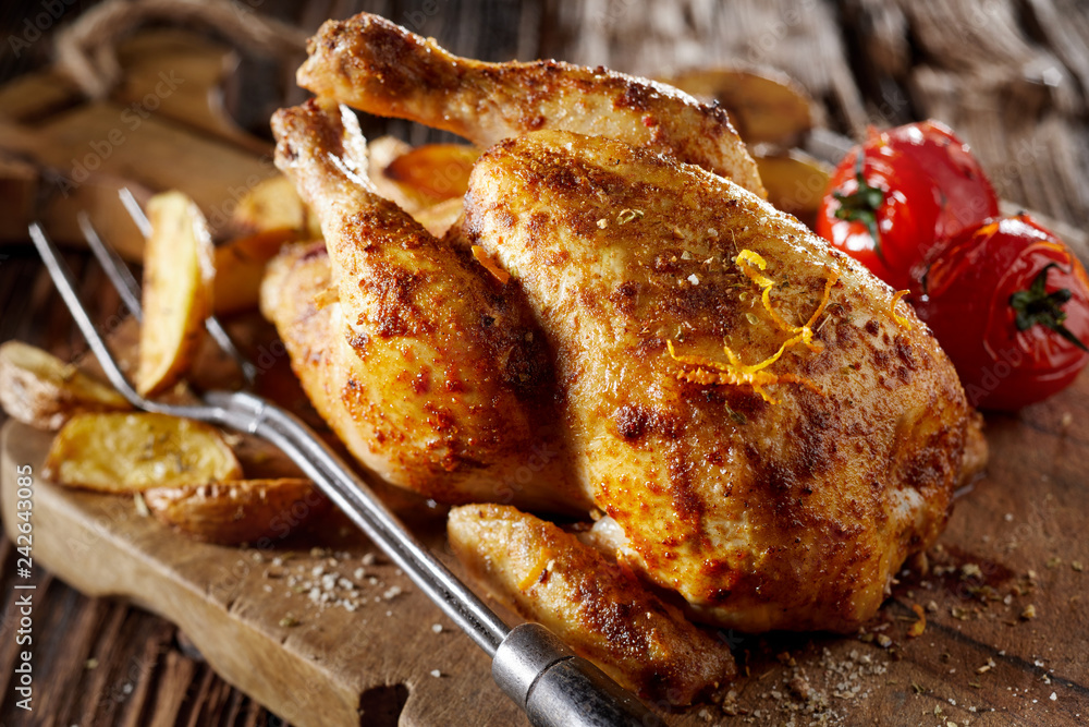 Photo Stock Grilled seasoned young poussin chicken | Adobe Stock