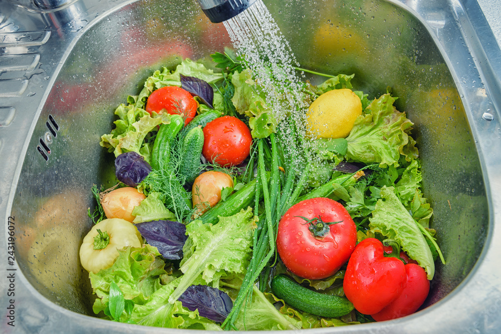 Wash vegetables before eating, very good for health. A group of ...