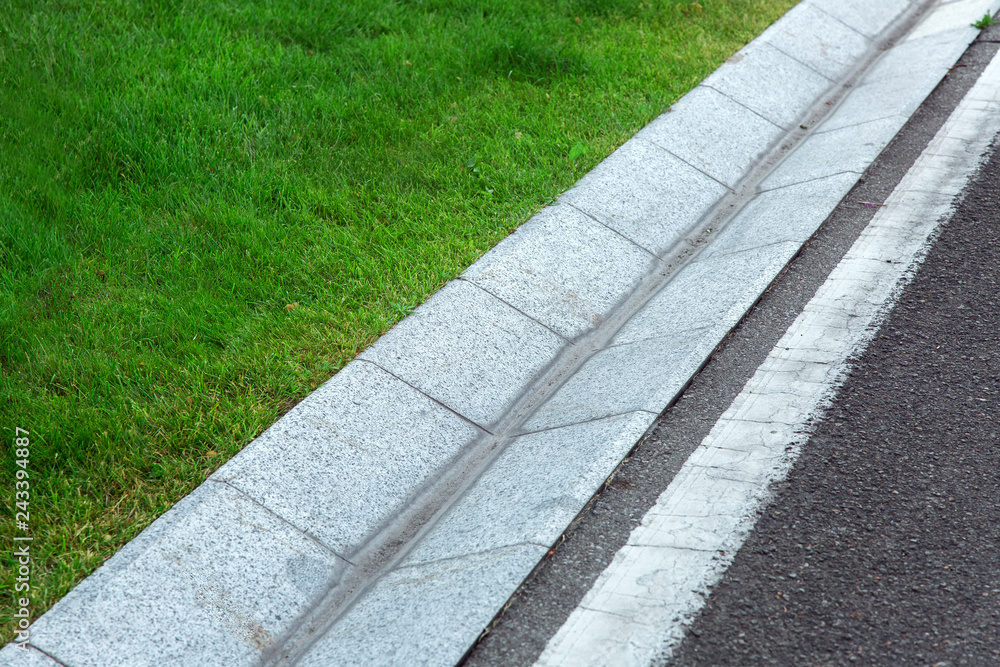 Street gutter of a stormwater drainage system on the side of an ...