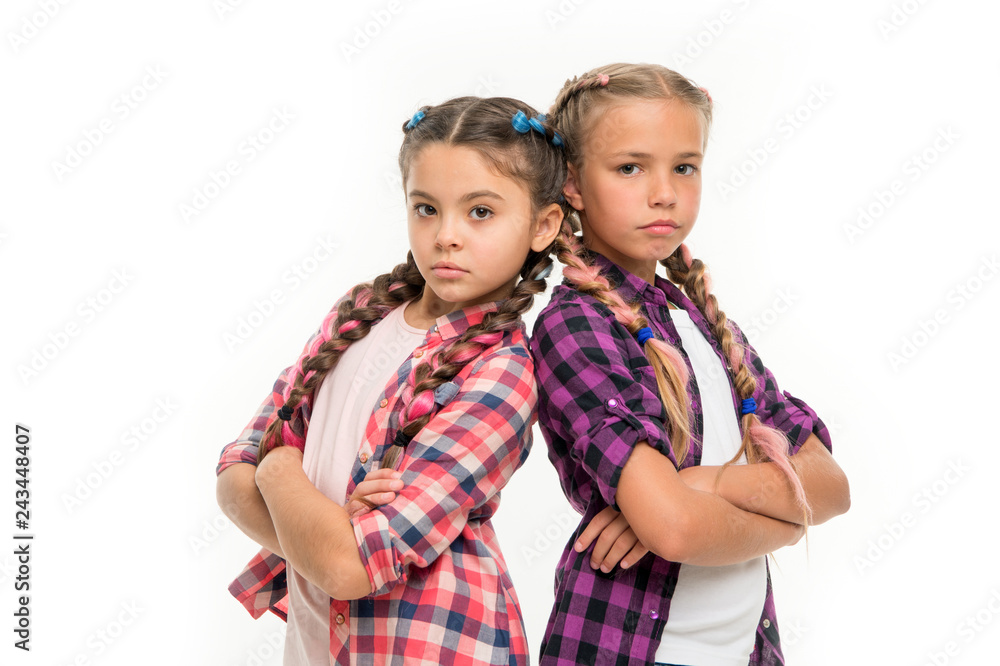Girls sisters stand back to back confidently. Friendship support and ...