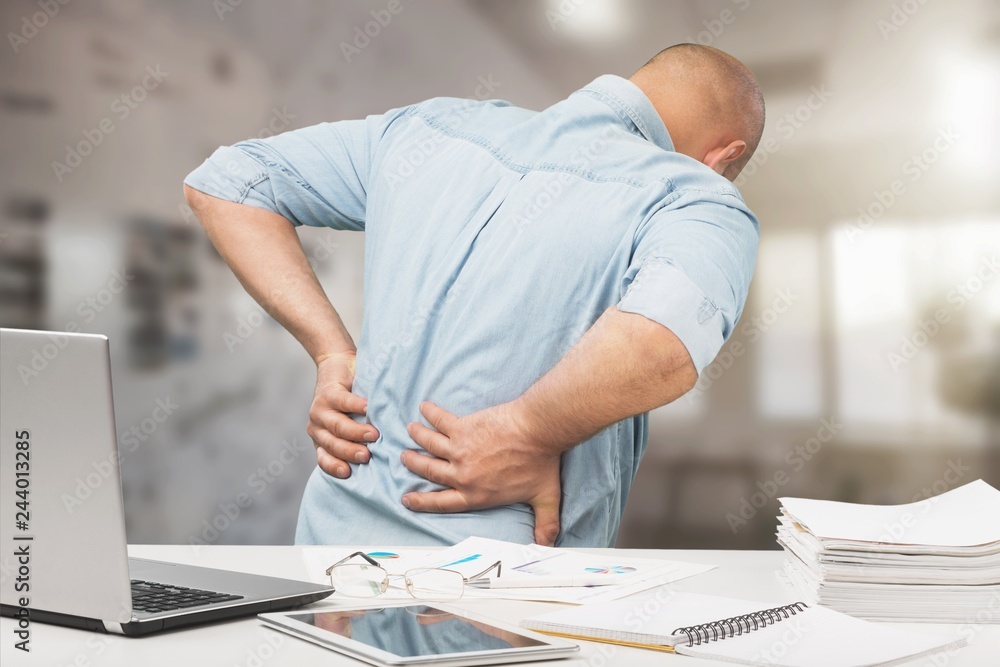 Back pain in office back pain office low massage ache Stock Photo ...