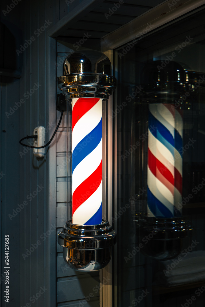 Barber-lamp. Symbol for a barber-shop with red and blue stripped lamp ...