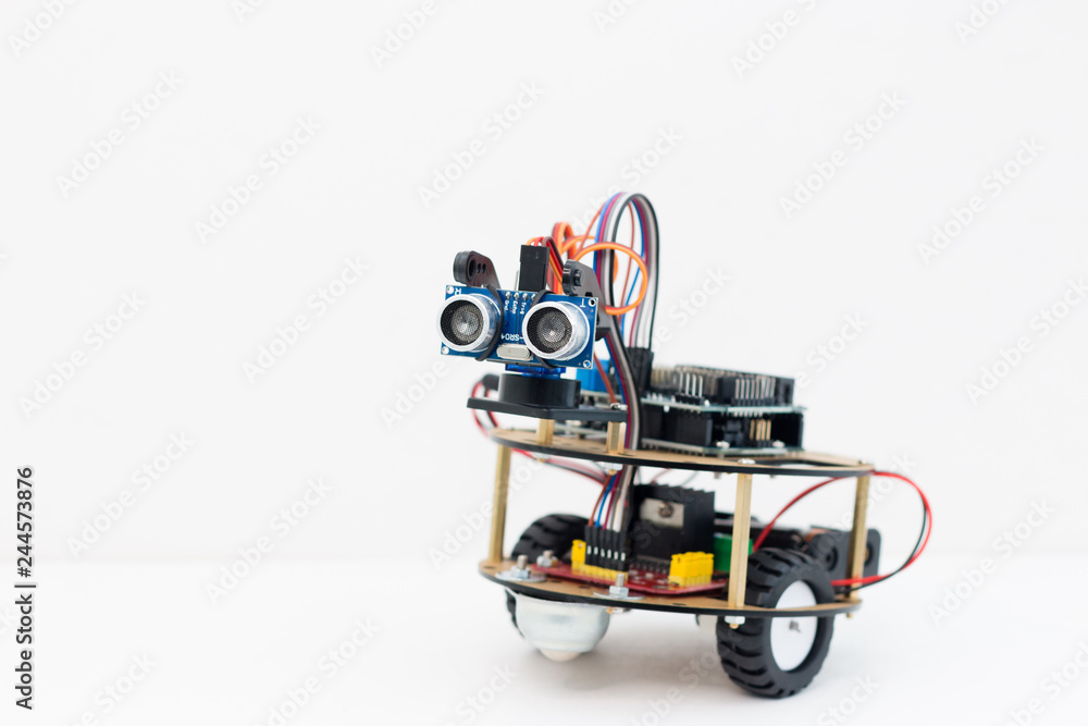 Hand made robot working on the arduino platform. White background. Free ...