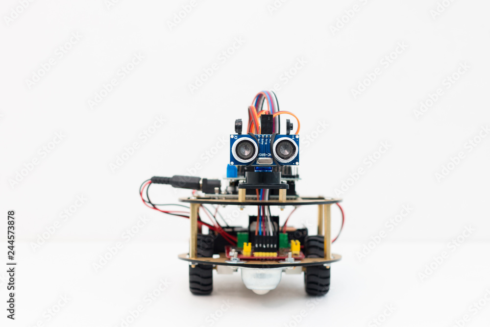 Hand made robot working on the arduino platform. White background. Free ...