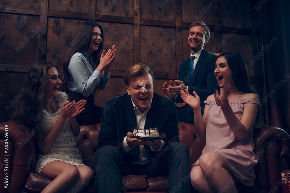 Handsome man's face covered in birthday cake Stock Photo | Adobe Stock