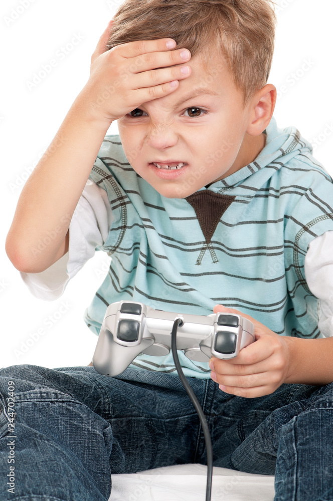 Unhappy little Boy Playing Video Games. Upset Child using video game ...