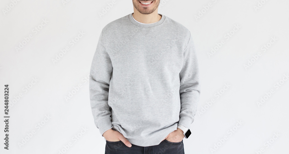Horizontal banner of young man in gray sweatshirt, standing isolated on ...