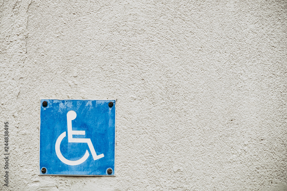 Symbole du handicap, pictogramme bleu et blanc Stock Photo | Adobe Stock