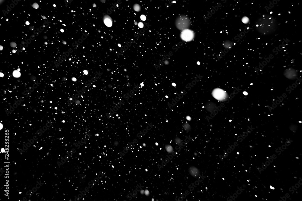 falling snow on a black background, snowfall at night, white spots on a ...