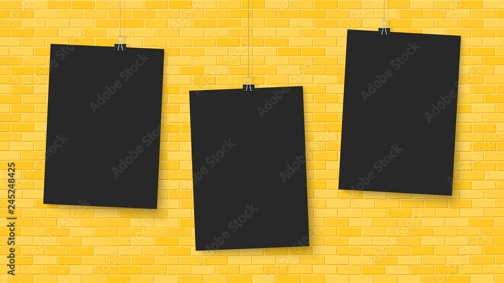 Posters on binder clips. Paper templates on brick wall. Realistic mock ...