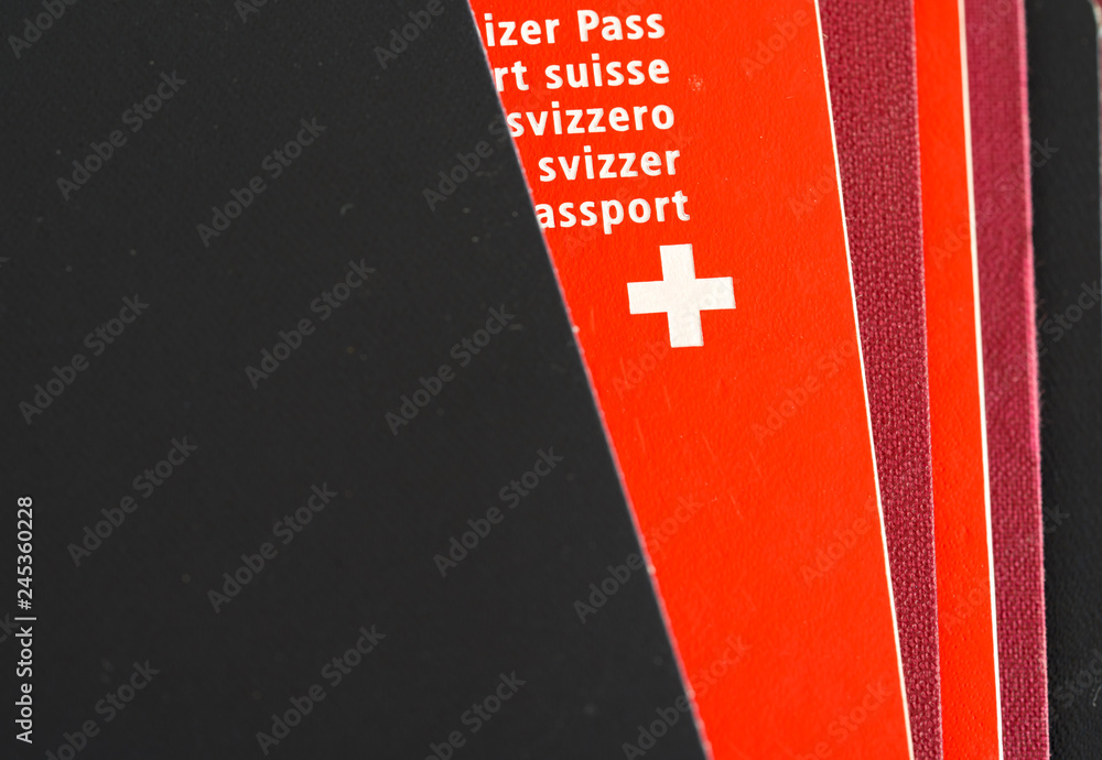 stack of passports up close with a Swiss passport in detail Stock Photo ...