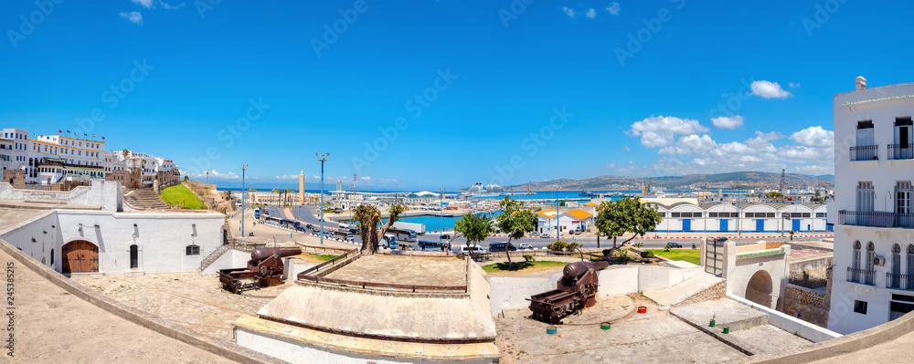 Ancient fortress with cannons and view of port and coastal structure in ...