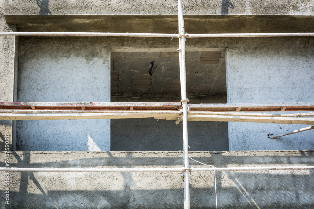 Construction of window frame with temporary ladder for lifting. Stock ...