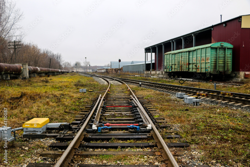 railway in the industrial zone..empty rails with a semaphore, in ...